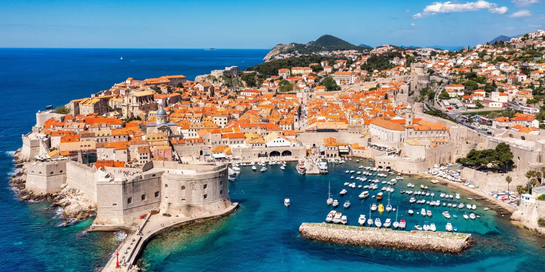 Fortified old town and stone harbor in Dubrovnik, Croatia.
