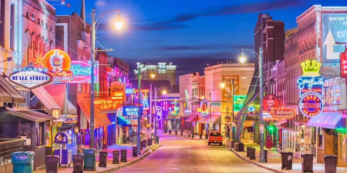 Neon signs and historic music venues on Beale Street in Memphis, Tennessee.