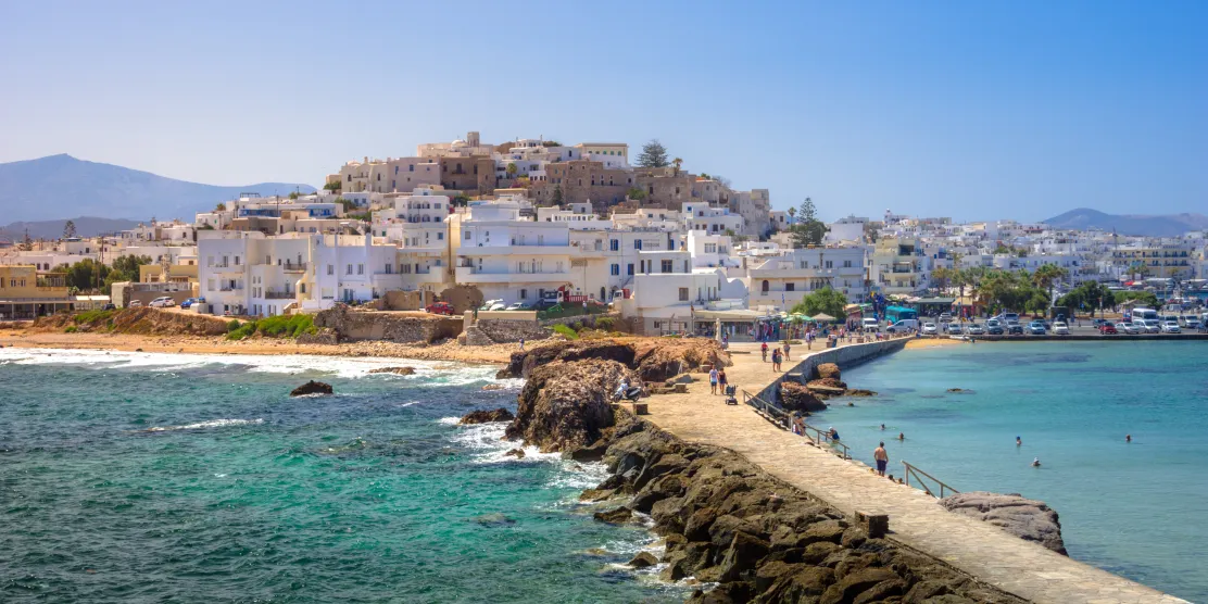 Traditional whitewashed houses on a rocky hillside in Naxos, Greece
