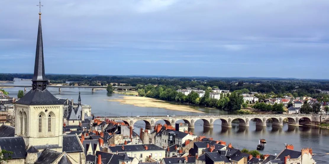 Loire Valley Castle road trip through Saumur, with the Loire River and historic bridge in France