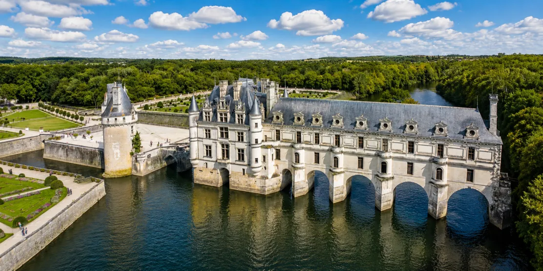 Aerial view of Château de Chenonceau spanning the River Cher in the Loire Valley, France