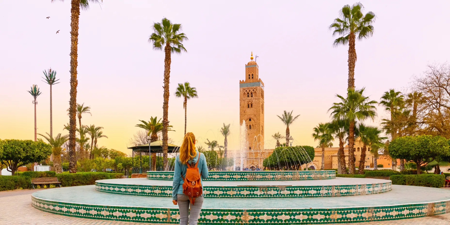 Woman standing in front of a mosque