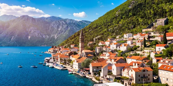 Aerial view of the turquoise Bay of Kotor and mountain coastline in Montenegro.
