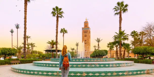 Woman standing in front of a mosque
